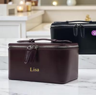 China Personalized PU Leather Makeup Vanity Case Women Travel Cosmetic Bag With Handle for sale
