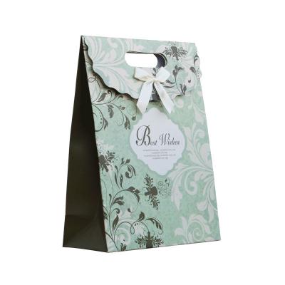 China Custom Wedding Gift Paper Bags with Die-Cut Handles & Ribbon – Luxury Party & Event Packaging for sale