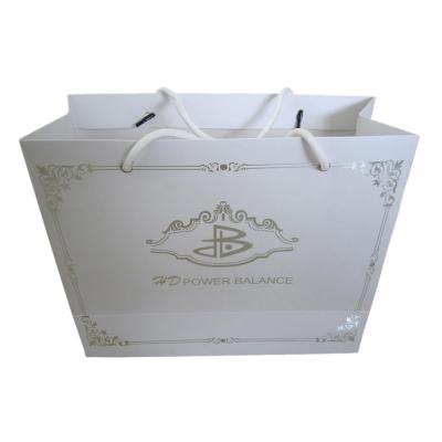 China Order Custom Printed Paper Merchandise Bag Business Packaging Online With Eyelet for sale