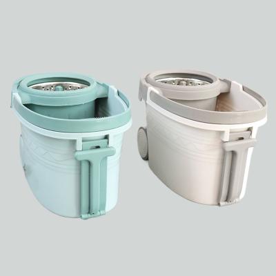 China Barrel Automatically Rotates Easy Wring Spin Mop And Bucket 360 Rotating For House Cleaning for sale