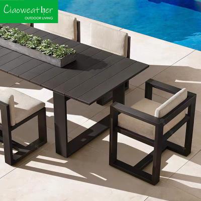 Cina Set da pranzo in legno massello di design moderno per mobili esterni Sedile laterale e poltrona in legno di teak nel giardino del cortile in vendita