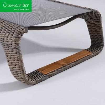 China Hotel Outdoor Pool Lounge Chairs with Vintage Wicker Design and Waterproof Cushions for sale