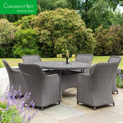 China Moderne buitenmeubelen Patio Rattan fauteuil Wicker Eetstoel met comfortabele kussens Te koop