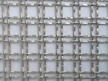 A piece of hard mesh with square holes.