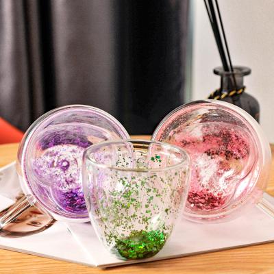 China Colorful Double Wall Glass Mug Heart Shape Coffee Mugs With Glitter Custom Packing for sale