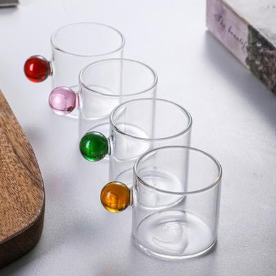 China 120ml Single Wall Glass Drinkware Breakfast Coffee Cups With Colored Ball Handle for sale