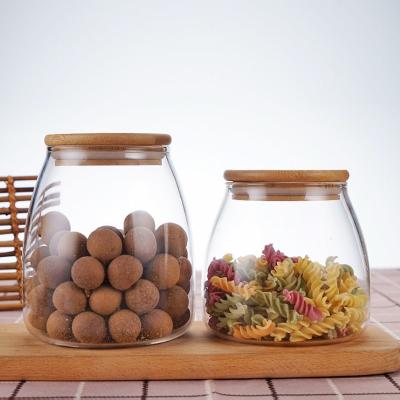 China Transparent Bamboo Lid Glass Storage Jar Customized Size Kitchen Glass Canister for sale