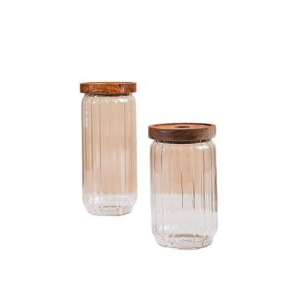 China Ripples Cylinder Borosilicate Glass Jar With Acacia Wood Lid For Tea Leaves Party Use for sale