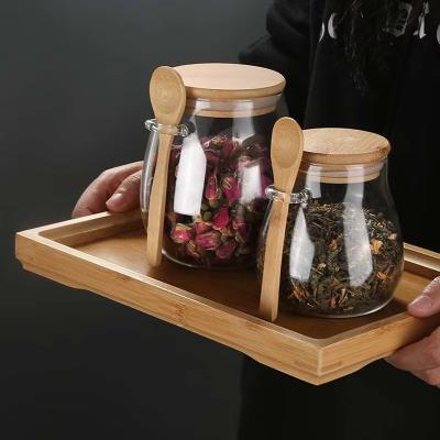 China Minimalist Design Borosilicate Glass Canister Spice Jar With Bamboo Lid Spoon for sale
