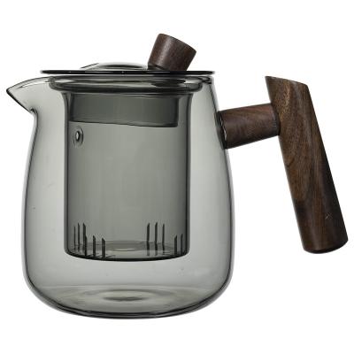 China 450ml Capacity Glass Tea Pot Borosilicate Tea Kettle With Wooden Handle Custom Logo for sale