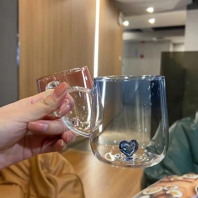 China OEM Logo High Borosilicate Glass Coffee Mug Heat Resistant Water Cup With Heart Inside for sale