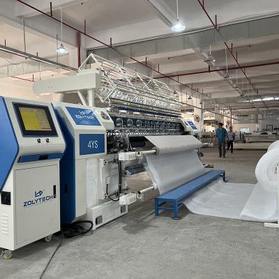 中国 ZOLYTECHは羽毛布団のためのロックのStichの多針のキルトにする機械をコンピュータ化した 販売のため