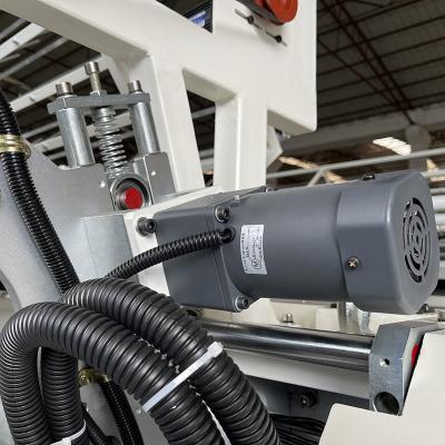 Cina Trapuntatrice del piumino con il dispositivo di rotolamento per la fabbrica dell'indumento in vendita