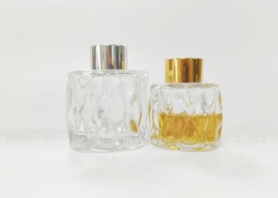 China Transparent Embossment Glass Bulk Reed Diffuser Bottles Fragrance for sale