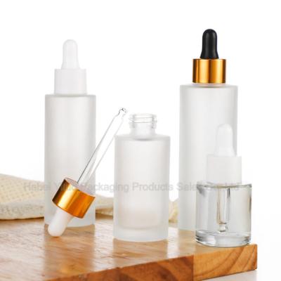 China Bulk Dropper Empty Essential Oil Bottles Clear 2oz Customize Logo for sale