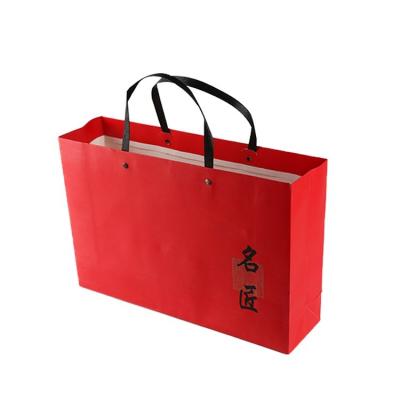 Cina Sacchi di carta stampati bianchi d'imballaggio di Kraft, sacchetti della spesa di carta con il logo in vendita
