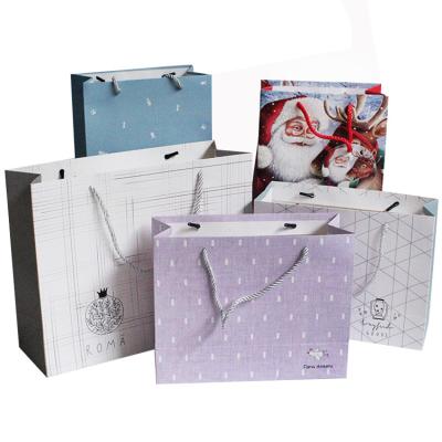 China Embossed Diamond Patterned Gift Handles Custom Shopping Paper Bag With Logo for sale