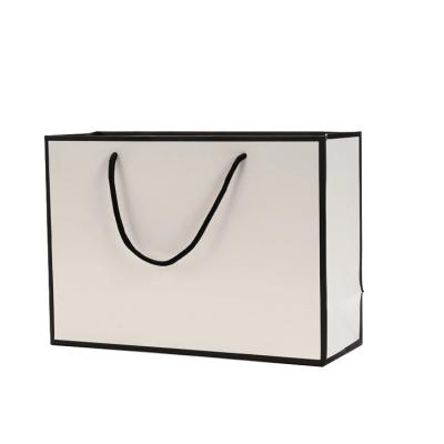 China Wholesale Luxury High-end Printed White Shopping Paper Bags With Your Own Logo for sale