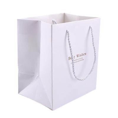 China Custom Printed White Carry Bags Luxury Boutique Clothes Retail Shopping Paper Packaging Bags For Clothes With Your Own Logo for sale