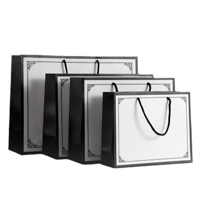 China Luxury Ribbon Handle Boutique Shopping Packaging Custom Printed Tote Paper Gift Bags With Logo for sale