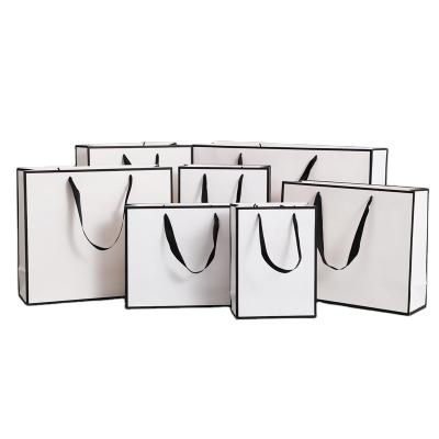 China Wholesale Blue Shopping Small Luxury Cheap Packaging Paper Bags For Jewelry With Ribbon Handle for sale