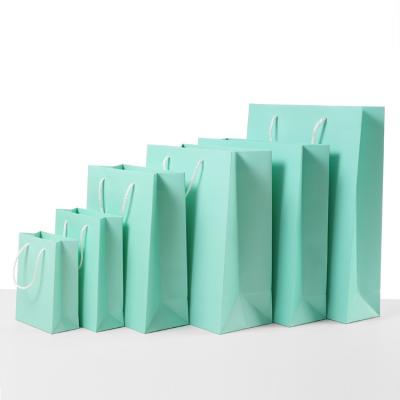 China Custom Printed Black Luxury Brand Retail Shopping Packaging Clothing Paper Bag With Logo for sale