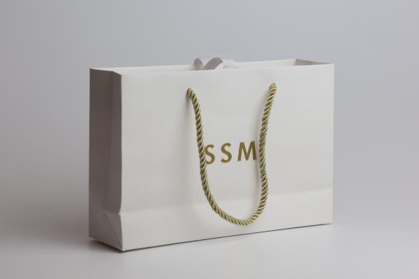 Quality Premium White Textured Specialty Paper Tote Bag with Gold Hot Stamped Lettering and Twisted Rope Handles for sale