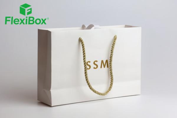 Quality White Textured Specialty Paper Tote Bag with Gold-Foiled Lettering and Twisted Rope Handles for sale