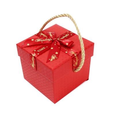 China Custom Order Accepted Eco Friendly White Packaging Box with Ribbon Bow and Handle for sale