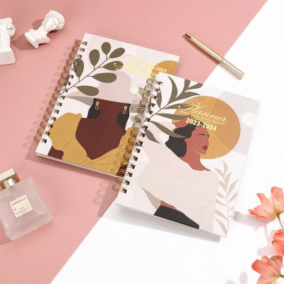 China Aangepaste bedrukking logo roze goudfolie A5 spiraalgebonden notitieboeken 2026 agenda maandelijks wekelijks dagelijks planners voor leraren OEM/ODM Te koop