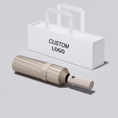 Cina Uomini d'affari regalo ombrello pieghevole triplo con logo personalizzato e 95cm di diametro aperto in vendita