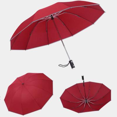 China Desenhos personalizados aceitos guarda-chuva automática de três dobras à prova de vento com lanterna LED à venda