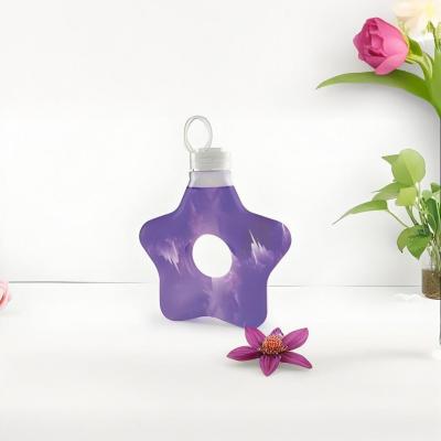 Chine Bouteille de jus en plastique de forme personnalisée 550 ml PP en forme de donut Bouteille en plastique PETG pour thé au lait avec couvercle à anneau de traction à vendre