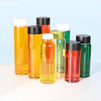China Botella de jugo PET redonda francesa vacía de 12Oz 16Oz para café frío, botellas de jugo de plástico reutilizables con tapas en venta
