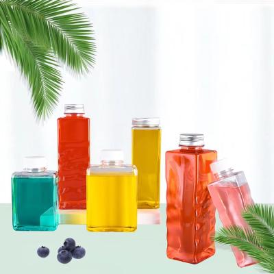 China Franse vierkante plastic sapfles 20oz drankjes fruit sap gemakkelijk open deksel Tamper proof cap voor energiedranken Te koop