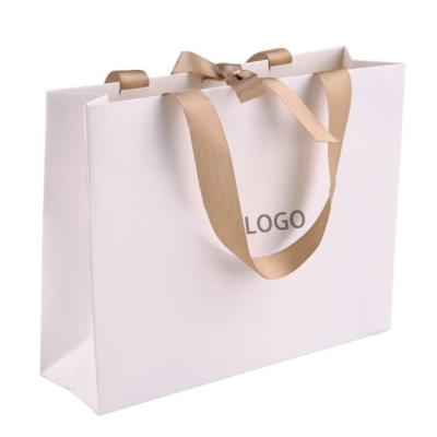 China Custom Printed Paper Gift Bag Made From Recyclable Materials Suitable For Retail Shops And Event Packaging for sale