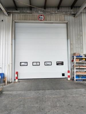 China sandwich shape Security standard sectional garage door with small door and small house for sale