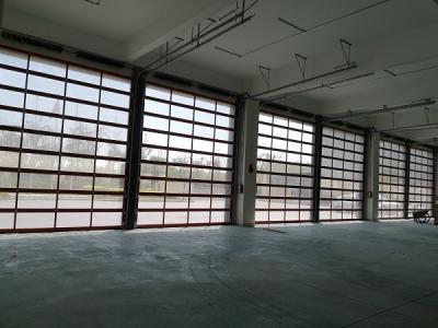 China Low price residential automatic black aluminum benefit glass sectional garage door for sale