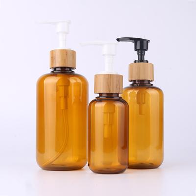 China Glass Roller Plastic Lotion Bottles With Bamboo Cover for sale