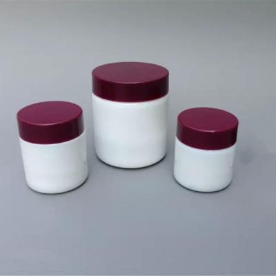 China 150mm Height 50g Frosted Amber Cosmetic Glass Jars With Lids for sale