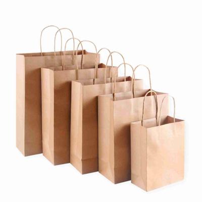China Os cáquis por atacado colorem sacos de papel de Kraft do Natal para o empacotamento da roupa à venda