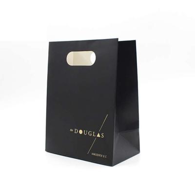China Custom Print Black Boutique Gold Hot Foil Paper Bag With Die Cut Handles for sale