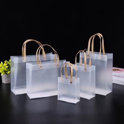 China XYDAN Frosted Rigid PVC Transparent Tote Bag mit weichem Loop-Griff gestreiftes Muster zu verkaufen