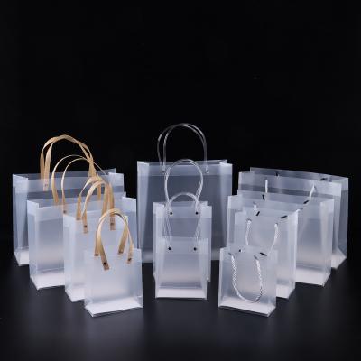 China XYDAN Frosted Rigid PVC Transparent Tote Bag mit weichem Loop-Griff gestreiftes Muster zu verkaufen