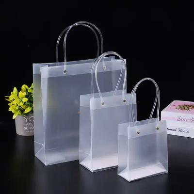China XYDAN Frosted Rigid PVC Transparent Tote Bag mit weichem Loop-Griff gestreiftes Muster zu verkaufen