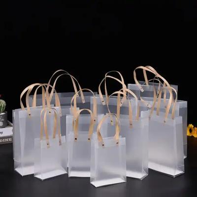 China XYDAN Frosted Rigid PVC Transparent Tote Bag mit weichem Loop-Griff gestreiftes Muster zu verkaufen