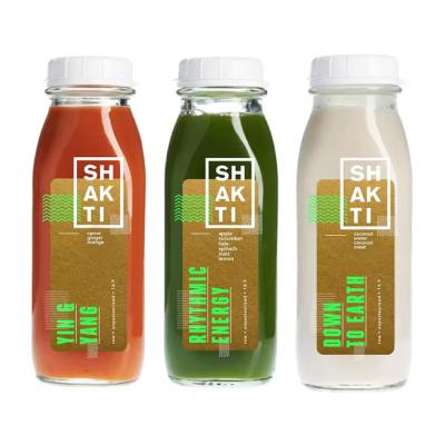 Cina 500 ml quadrati 1000 ml di latte vuoto succo di frutta bevande bottiglie di vetro con tappo bianco a prova di manomissione in vendita