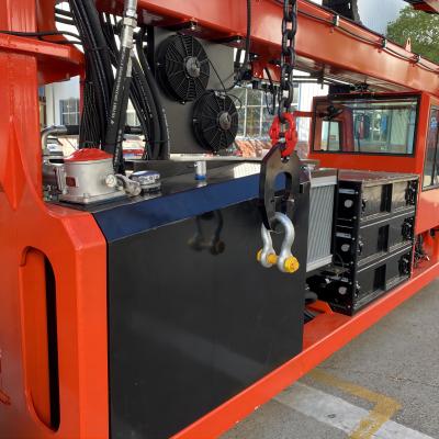 Κίνα 70T ηλεκτρικός καβαλικεύστε ανυψωτικό όχημα εμπορευματοκιβωτίων μεταφορέων το κόκκινο για τα μεγάλου μεγέθους βαριά φορτία προς πώληση