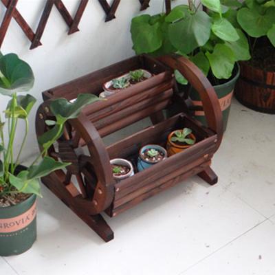 China Outdoor garden wheel decoration wooden flower pot wooden plant buckets for sale