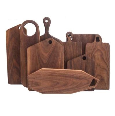 China Creative Irregular shape Black walnut wooden cutting board sushi board hot sale for sale